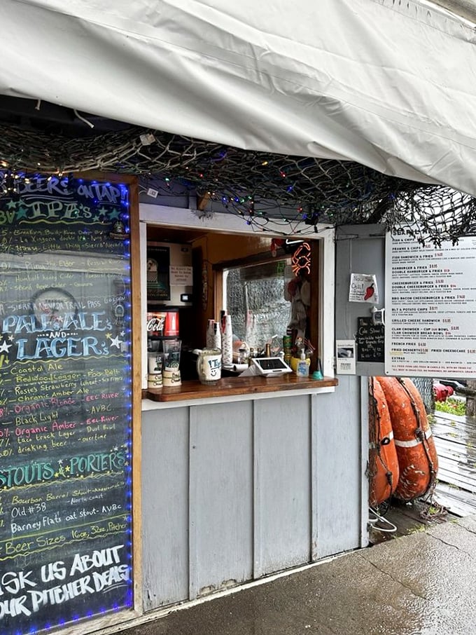 The ordering window—where dreams come true and diets go to die. Notice the fishing nets above—they caught your appetite.
