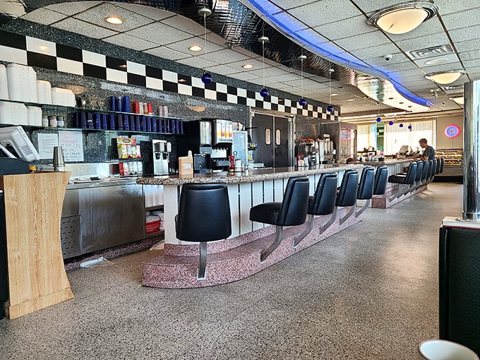 The counter—where solo diners find community, regulars have unofficial assigned seats, and the coffee cup is never empty for long.
