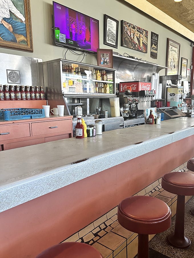 The counter tells stories of countless elbows, coffee cups, and conversations – a front-row seat to the short-order ballet that unfolds daily.