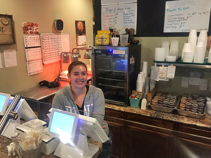Where barbecue dreams begin! That smile isn't just customer service—it's the confidence of someone who knows you're about to have a religious experience.