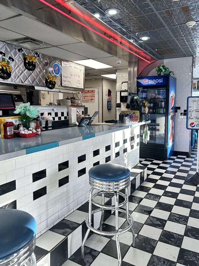 The counter where magic happens—where solo diners become regulars and regulars become family. Those chrome stools have supported generations of Michigan behinds.