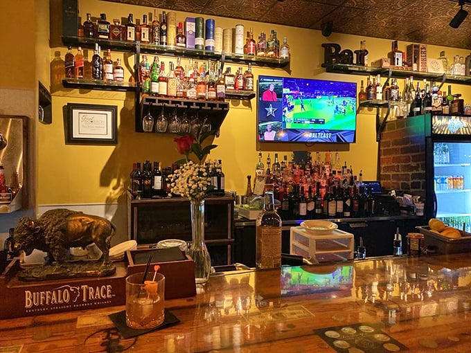 The bar area – where Buffalo Trace meets flat screens in a space that invites you to linger over a perfectly crafted Old Fashioned while the game plays on.