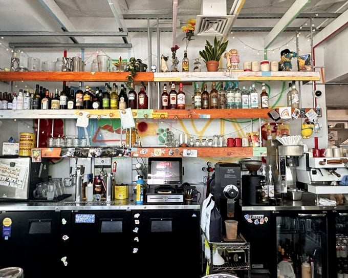 Behind the counter, a carefully curated collection of spirits and knickknacks tells you this isn't some corporate operation—it's someone's passion project.