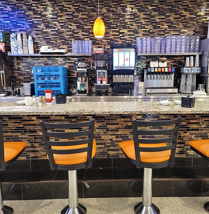 The drink station isn't just serving coffee—it's dispensing liquid optimism in those thick white mugs that somehow make everything taste better.