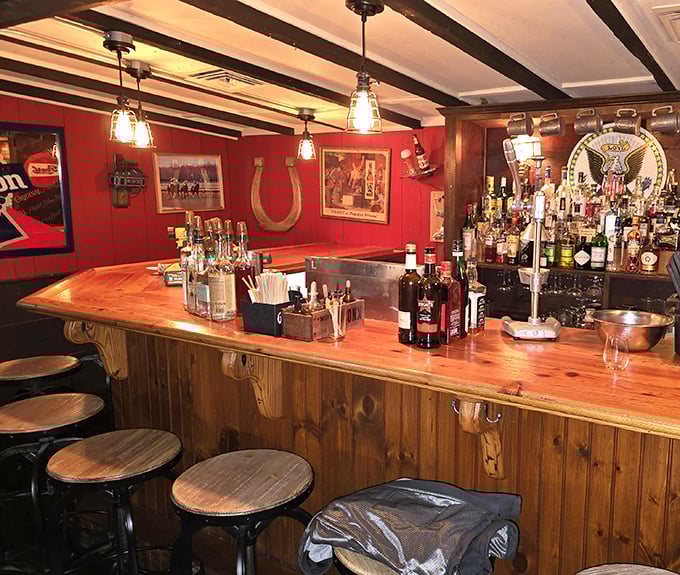 The bar's wooden counter and red walls create that perfect neighborhood watering hole vibe – where everybody might not know your name yet, but they soon will.