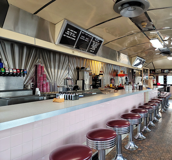 The counter seating at Nancy's isn't just functional—it's social infrastructure. Those red vinyl stools have heard more local news than the town paper.