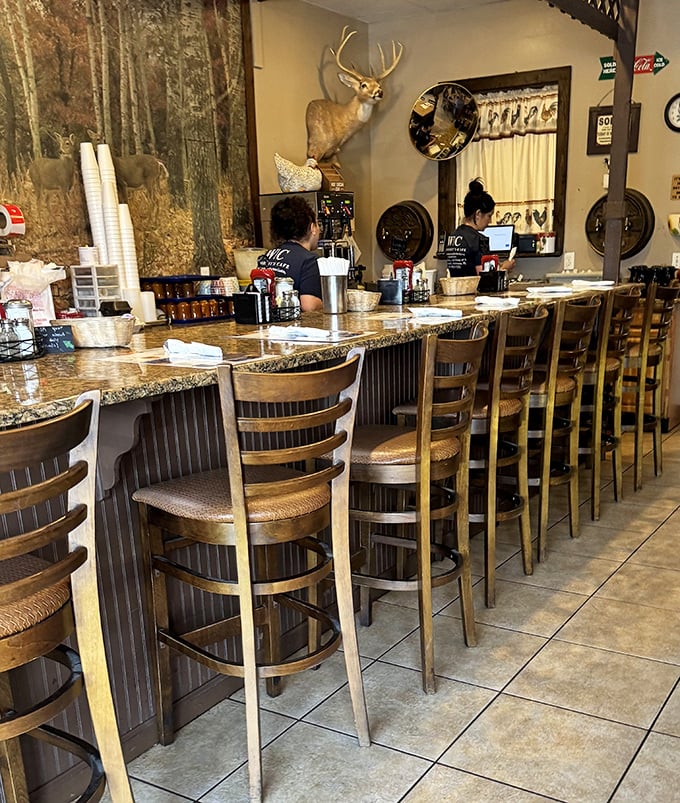 The counter seating—where solo diners become temporary family and servers remember how you take your coffee after just one visit.