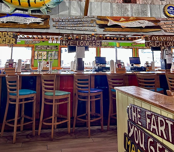 The bar area where "Eat Fish, Live Longer" isn't just a cute saying—it's practically a scientific fact when the catch is this fresh and the company this good.