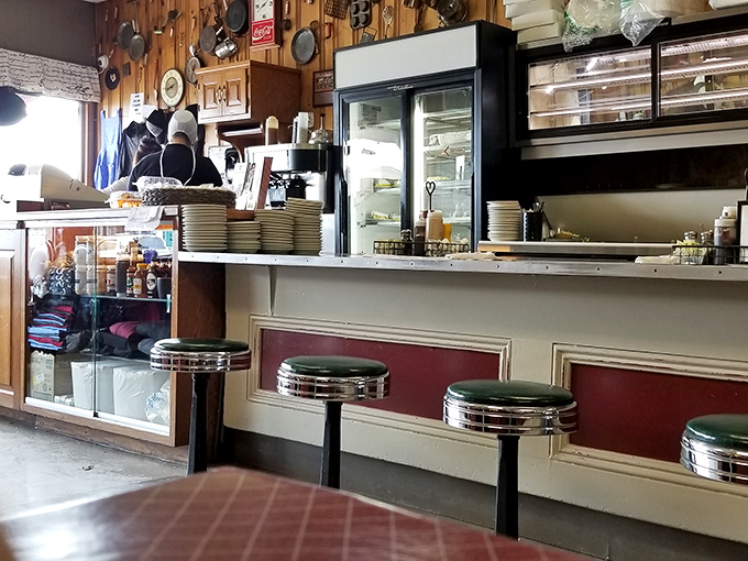 The counter and stools aren't designed by famous architects—they're engineered by decades of elbows, conversations, and coffee spills into something far more valuable.