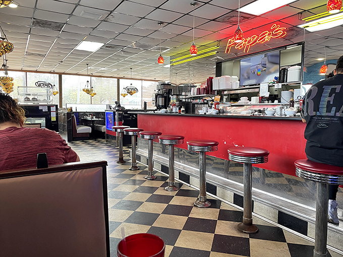 The counter seating – diner sociology's front row. Where solo diners become temporary neighbors and coffee refills are just a glance away.