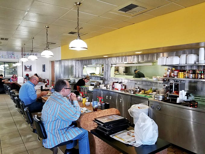 Counter seating: where solo diners become temporary neighbors and the short-order symphony plays just inches from your coffee cup. 