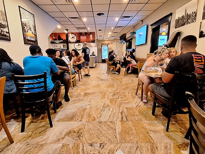 The dining room hums with the satisfied murmurs of pizza pilgrims who've found their holy grail in an unexpected Florida location.