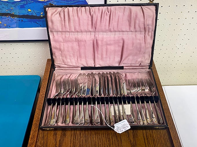This silver cutlery set awaits its next dinner party—elegant utensils that elevate meals from mere eating to dining.