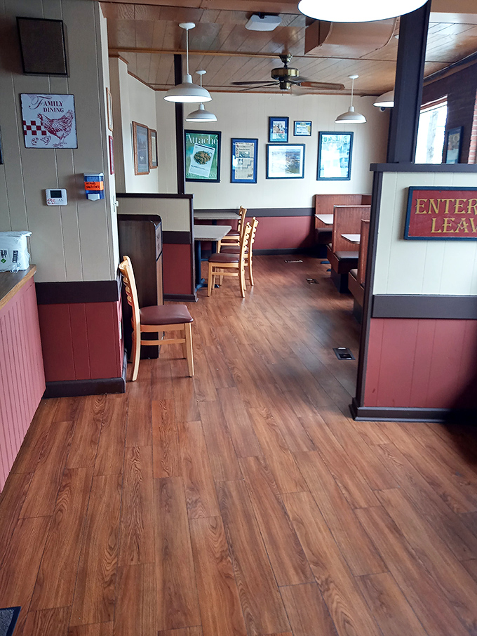 Clean lines, wooden booths, and simple decor—because nothing should distract from the main event. This dining room knows its priorities.