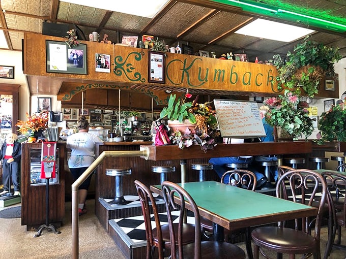 Every inch of wall space holds a piece of Perry history. The green-topped tables have supported more elbows and good meals than anyone could count.