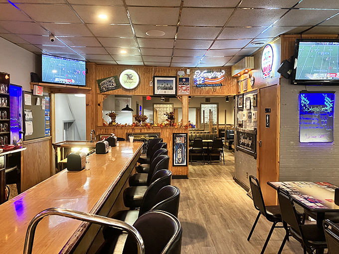 Sports on TV, neon signs glowing, and conversations flowing—this is where community happens, one meal at a time.