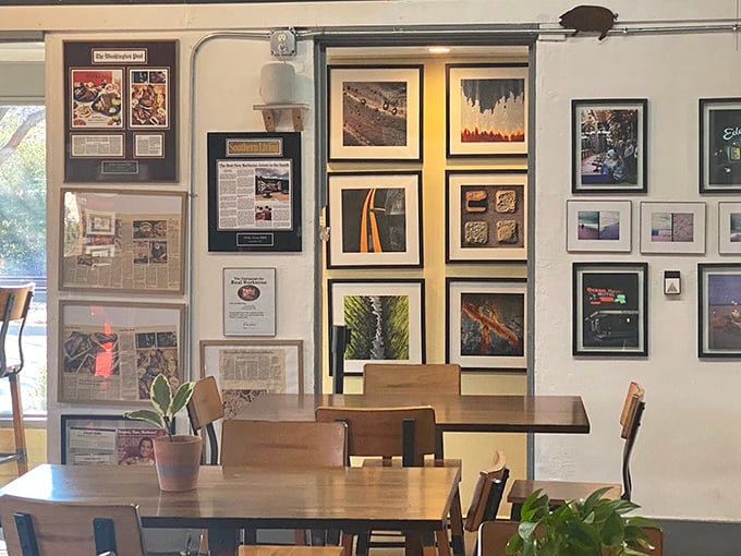 Wall art tells barbecue stories while you wait - every photograph a love letter to American smoking traditions.