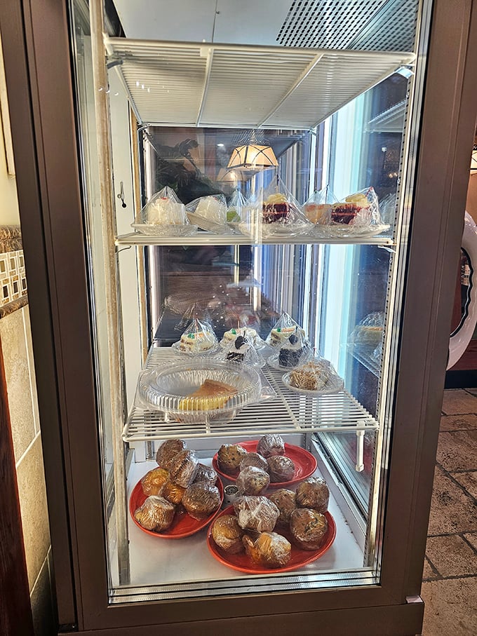 The dessert case—where willpower goes to die and happiness begins. Each wrapped treasure promises a sweet ending to any meal.