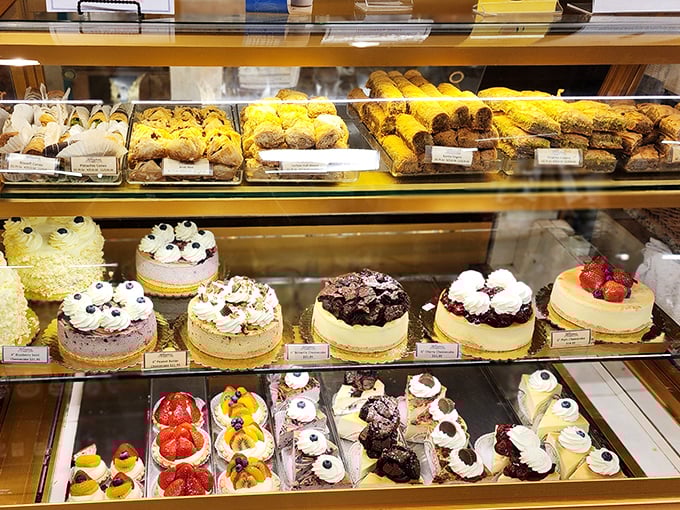 The dessert case that ruins all good intentions. After seeing these sweet masterpieces, suddenly there's always "room for just a little something."