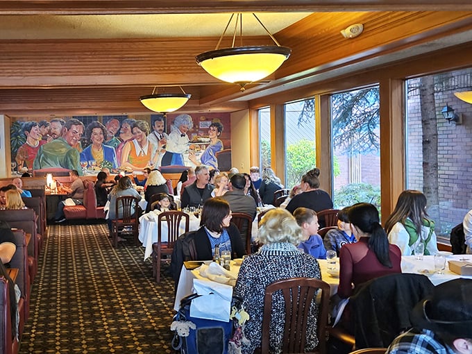 A bustling dining room where conversations flow as freely as the drinks. That mural watches over diners like a guardian angel of good times.