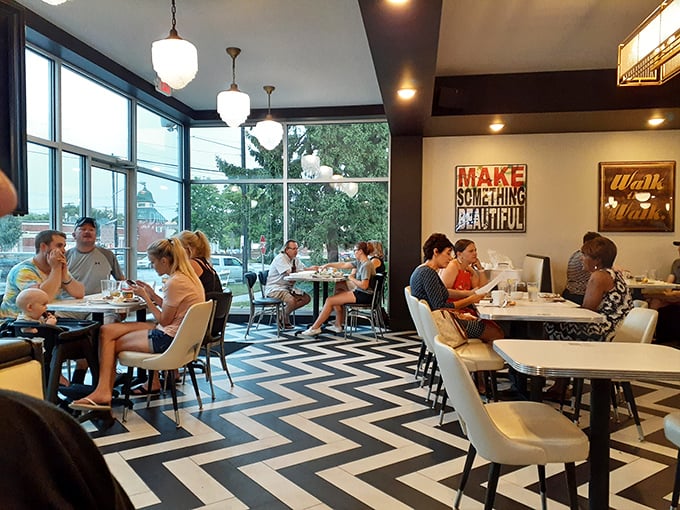 Where strangers become neighbors over eggs and coffee. The sunlight streaming through those windows could make even a Monday morning bearable.