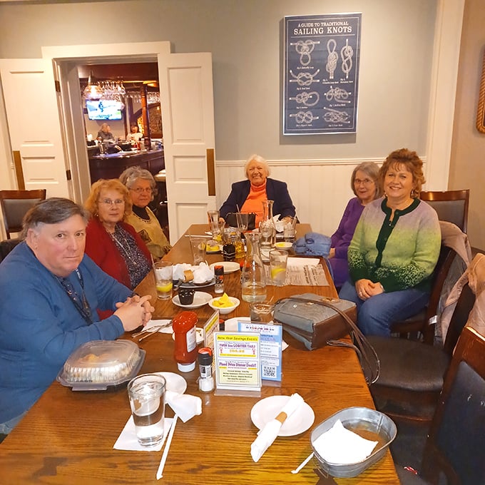 Happy diners gathered around wooden tables—the universal sign that you've found a place worth bringing the whole crew.