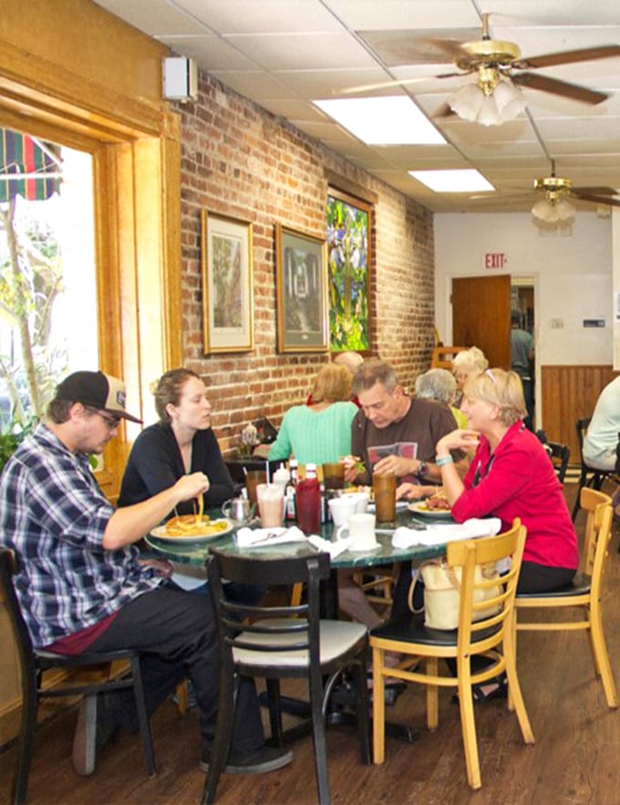 A snapshot of Savannah life – locals and visitors sharing tables, stories, and the universal language of "please pass the syrup."
