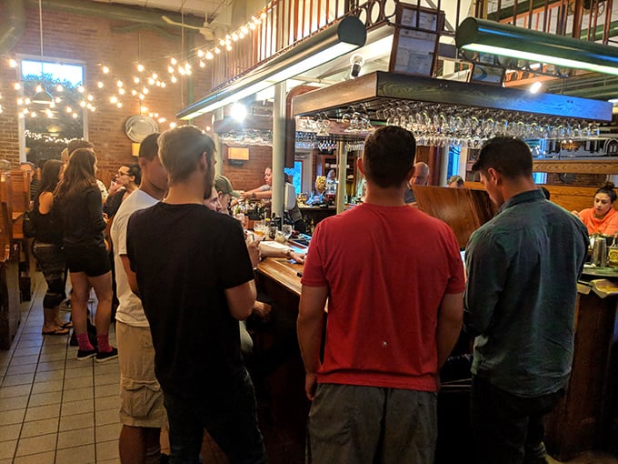 Where strangers become friends over shared plates and craft beers. The string lights aren't just decoration—they're conversation starters.