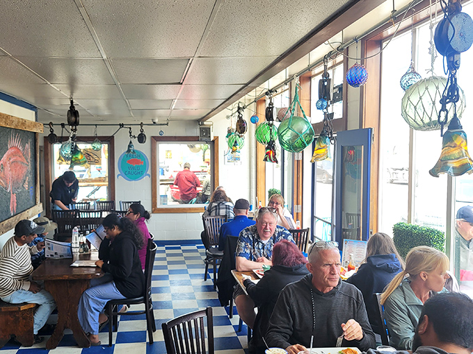 The dining room buzzes with the universal language of seafood satisfaction – that particular silence that falls when everyone is too busy enjoying their food to speak.