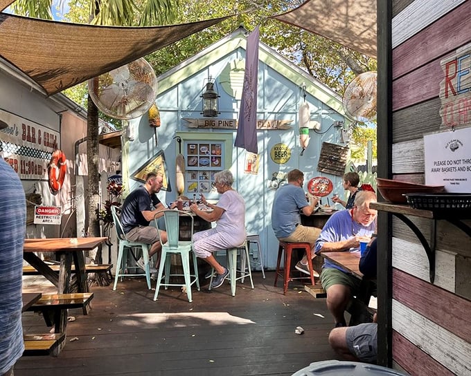 The true measure of a great seafood joint? Locals and tourists sitting elbow-to-elbow, all wearing the same expression of pure satisfaction.
