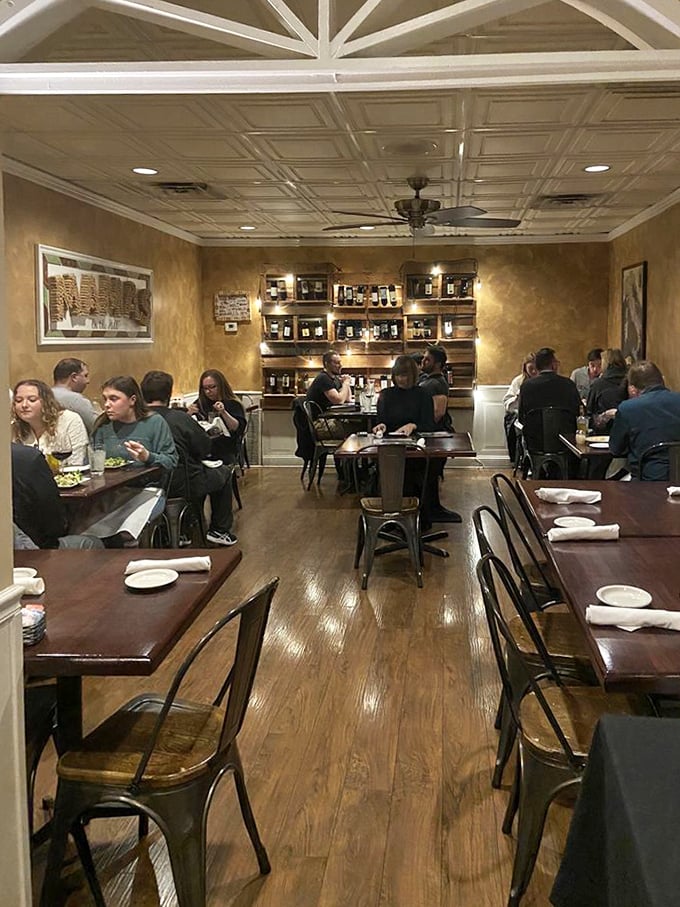 Diners lost in conversation and communion with their pasta—the universal language of Italian food bringing people together.