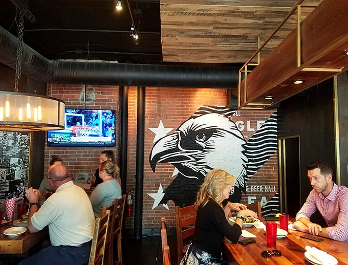 The Eagle's distinctive wall art watches over diners enjoying their feast—a silent guardian of good taste and Southern hospitality.