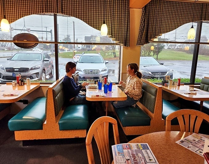 Classic diner booths—where conversations flow as freely as the coffee. These vinyl-covered time machines have witnessed countless life moments.