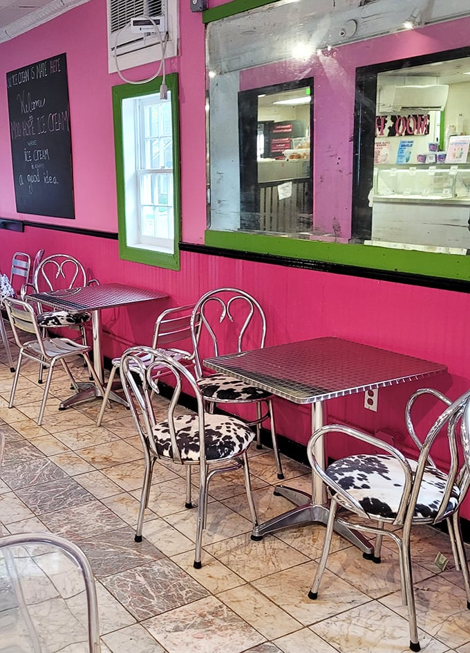 Pink walls, cow-print chairs—this seating area isn't just retro-chic, it's the perfect backdrop for ice cream euphoria.