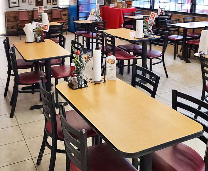 Simple tables, burgundy chairs, and paper towel rolls at the ready—because when the chicken's this good, napkins just won't cut it.