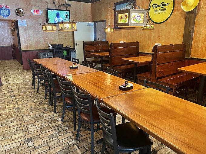 The dining area's wooden booths offer cozy corners for intimate conversations or serious contemplation of your next menu selection.