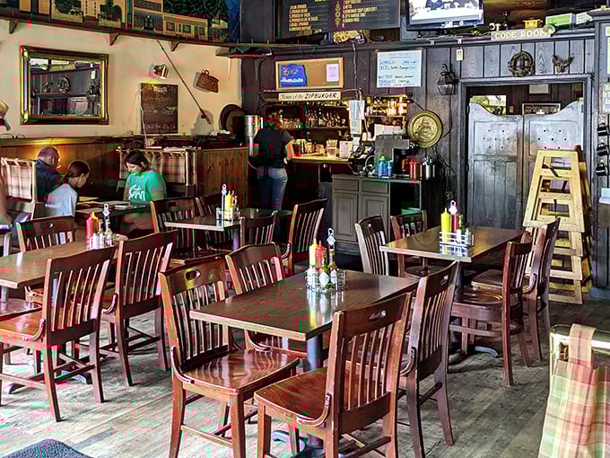 Wooden chairs, plaid accents, and that warm glow – Zip's nails the cozy neighborhood vibe that chain restaurants try desperately to replicate.