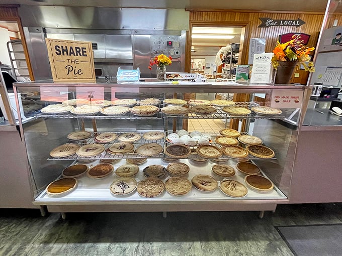 The pie display case—a museum of edible art where every piece deserves its own moment of silent appreciation.