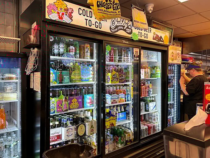 The beverage selection – because washing down a proper cheesesteak requires proper hydration. Choose your companion wisely.
