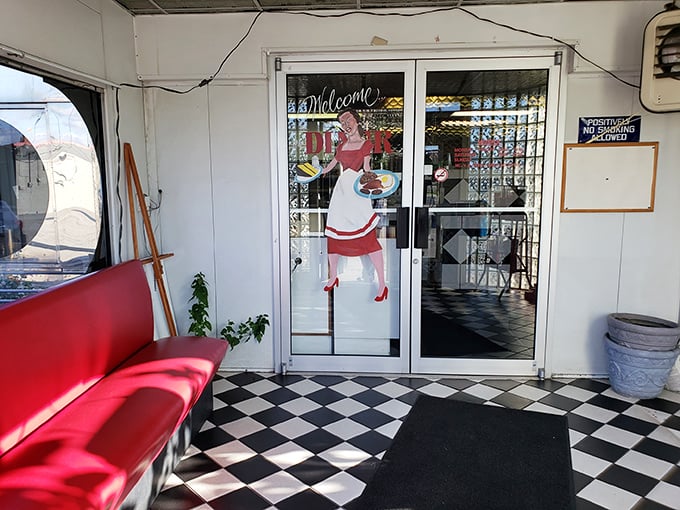 The entrance promises what every great diner should: a warm welcome, a checkered floor, and the promise of comfort food ahead.