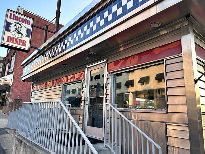 That classic stainless steel exterior with its checkerboard trim isn't just decoration—it's a promise of authentic diner experience waiting inside.