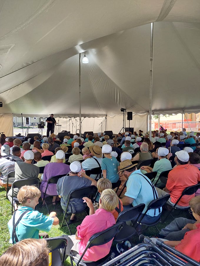 Under the big tent, generations gather for music and community—the original social network, no Wi-Fi password required.