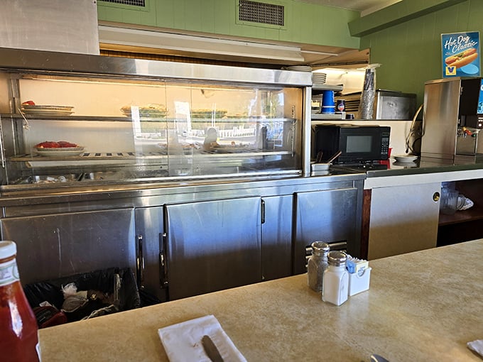 Behind the scenes where the magic happens – no fancy equipment, just decades of know-how and a well-seasoned grill.