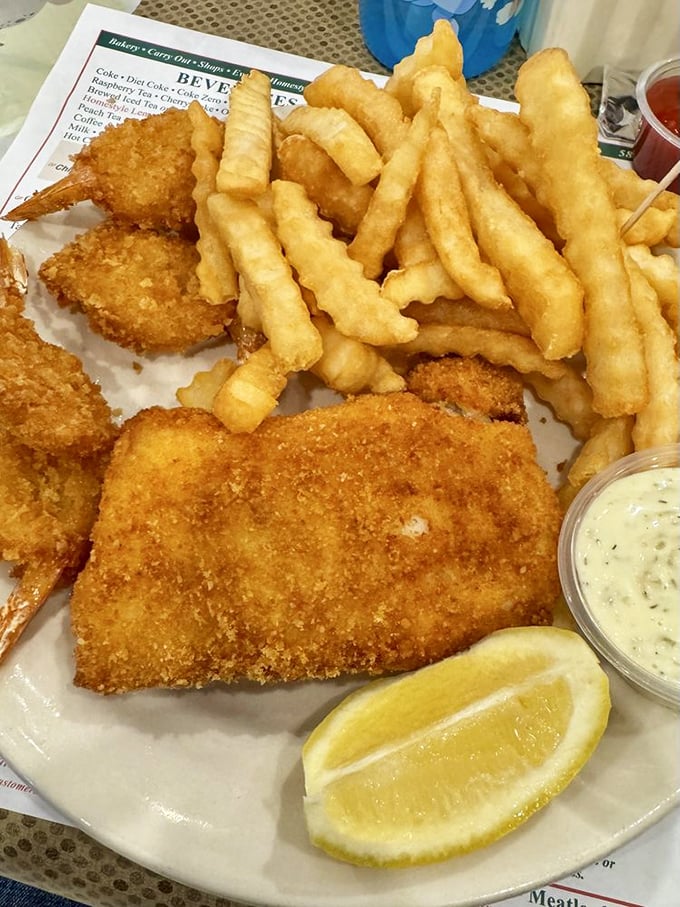Crispy beer-battered fish fillets and golden fries deliver seaside satisfaction hundreds of miles from any ocean.