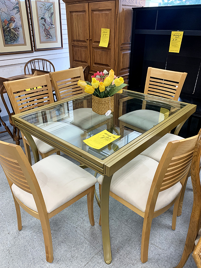 A modern glass dining set sits pretty, ready to host everything from Tuesday night takeout to Sunday family gatherings.