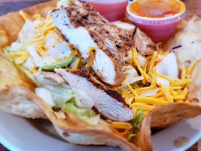 Fresh grilled chicken taco salad served in a crispy shell—because salads should never be boring punishment food.