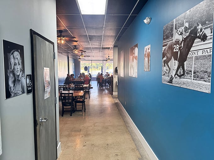The hallway gallery walk – where legends of music and sport watch over diners. Blue walls create the perfect backdrop for black and white memories.