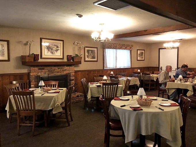 This cozy dining area with its brick fireplace feels like dinner at a friend's ranch house—if your friend happened to be a steak-grilling savant.