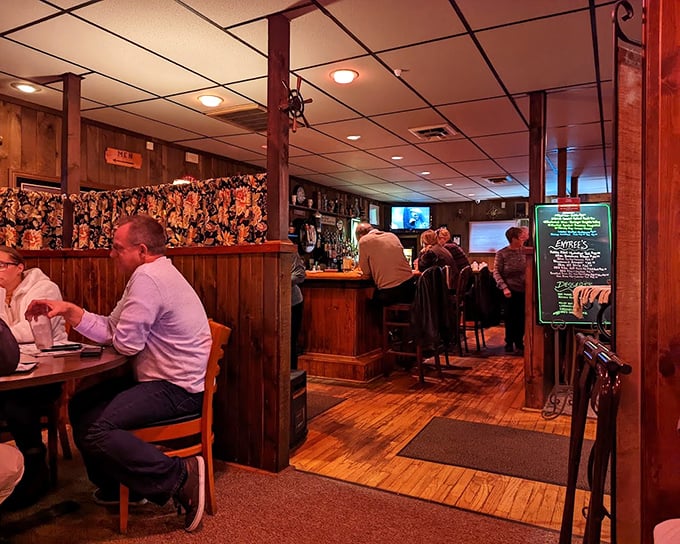 The bar area – where strangers become friends over Old Fashioneds and shared appreciation for what's about to arrive on their plates.