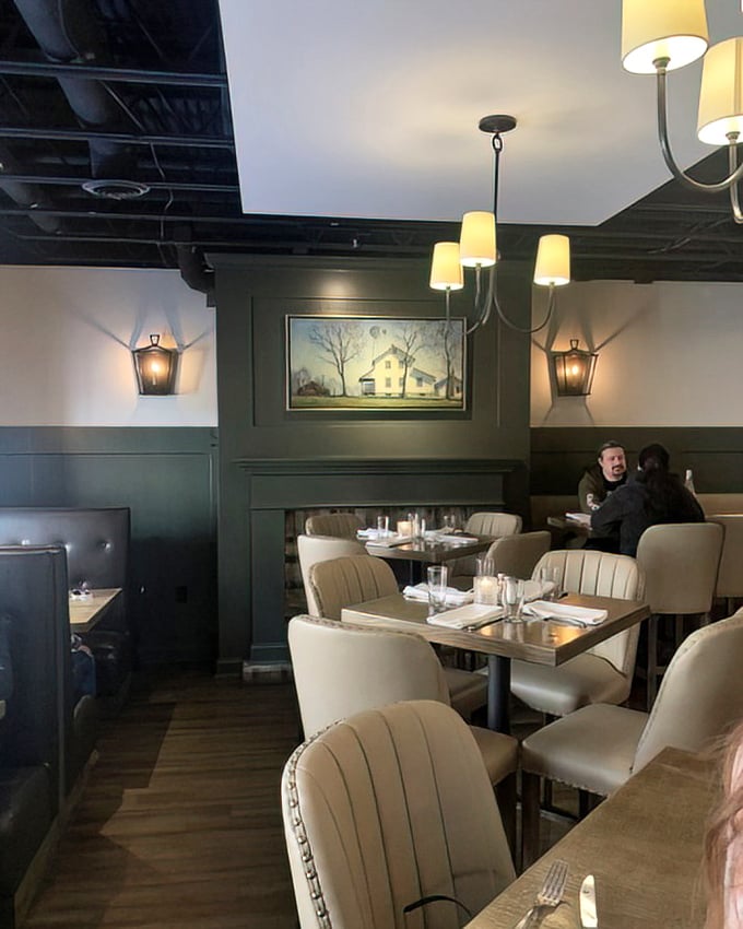 Green walls, cream chairs, and thoughtful lighting create dining spaces that feel both special and comfortable – like dining in a stylish friend's home.